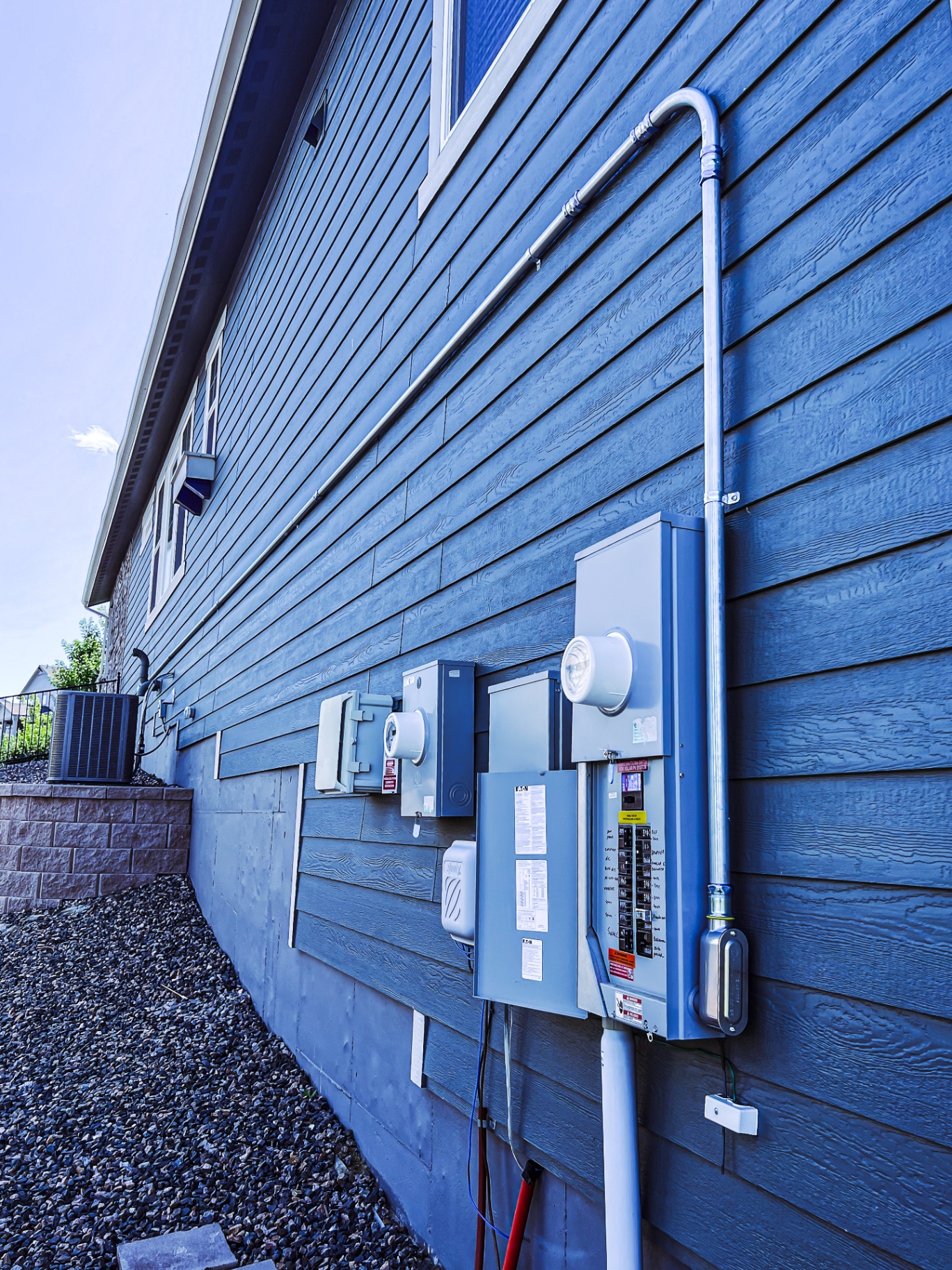Exterior conduit runs and meter bank installation
